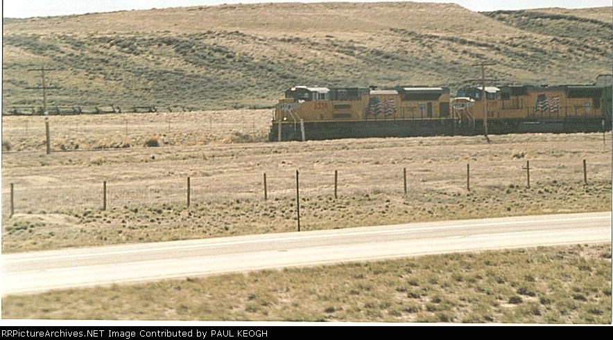 UP 8338 leads a Vehicle train west